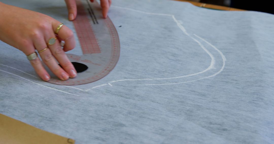 Hands Tracing Sewing Pattern on Fabric for Garment Design