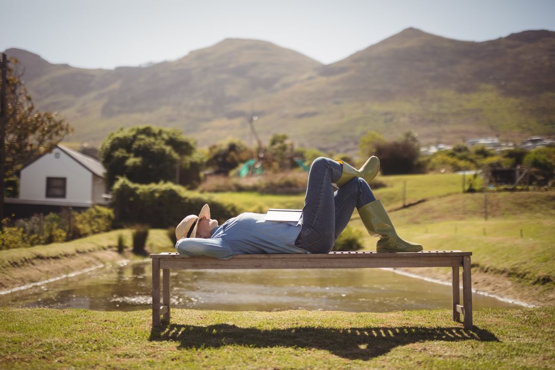 Relaxed Senior Woman Resting on Park Bench with Scenic Background ...