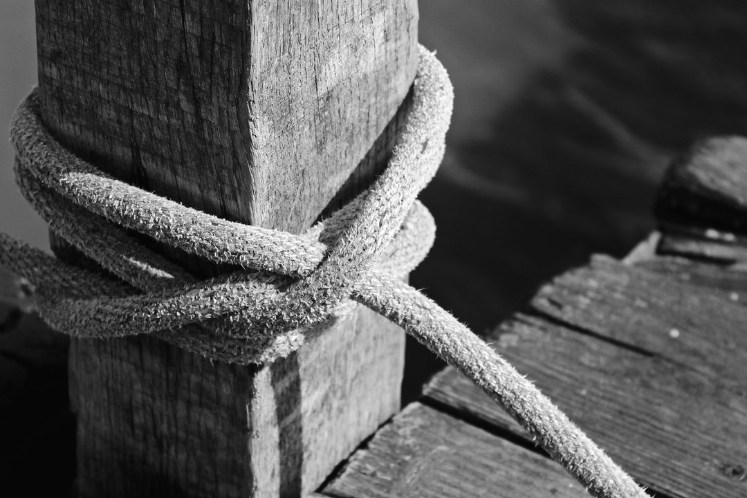 Close-Up of Worn Rope Tied Around Weathered Wooden Post - Free Stock ...