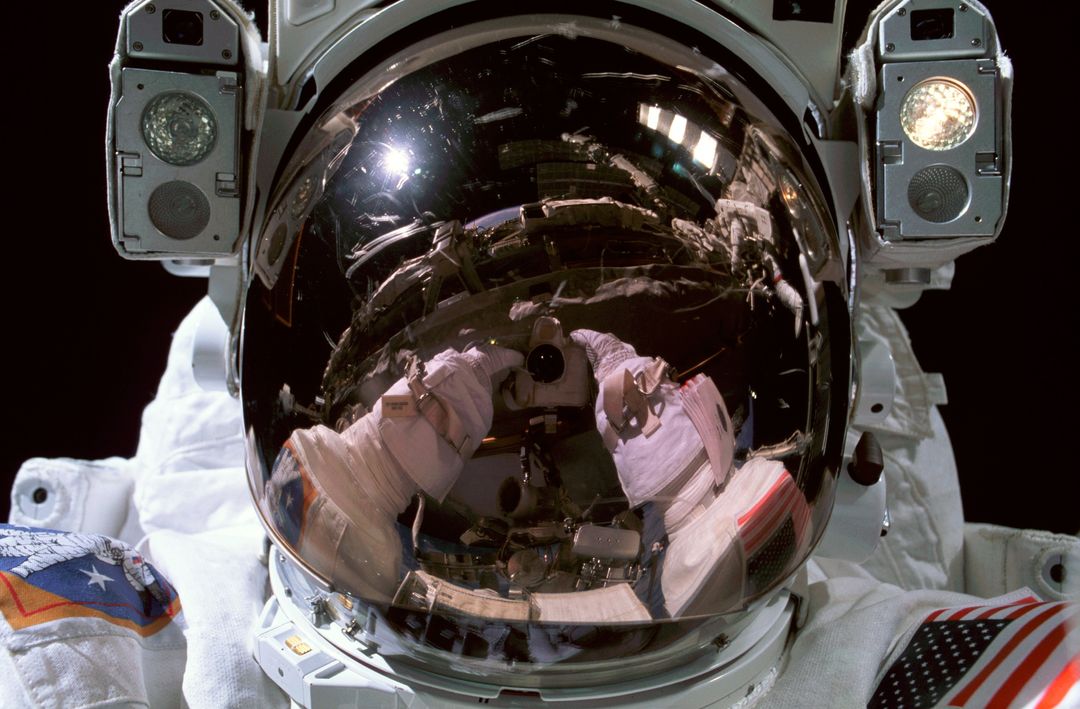 Astronaut's Reflection in Space Helmet During Extravehicular Activity ...